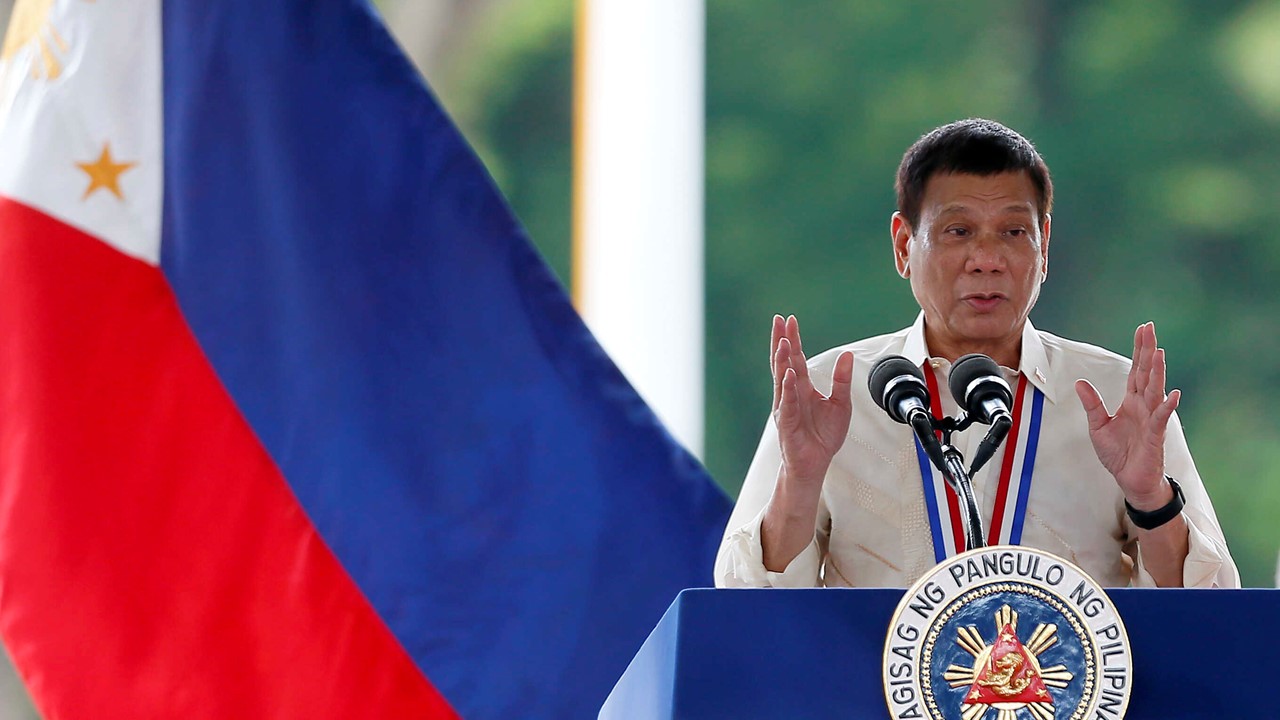 DUTERTE WITH FLAG - RMN Networks